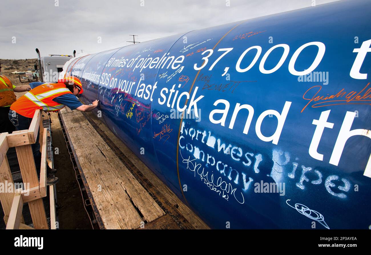 Aubree Lujan of Double D Transportation autographs the last section of ...