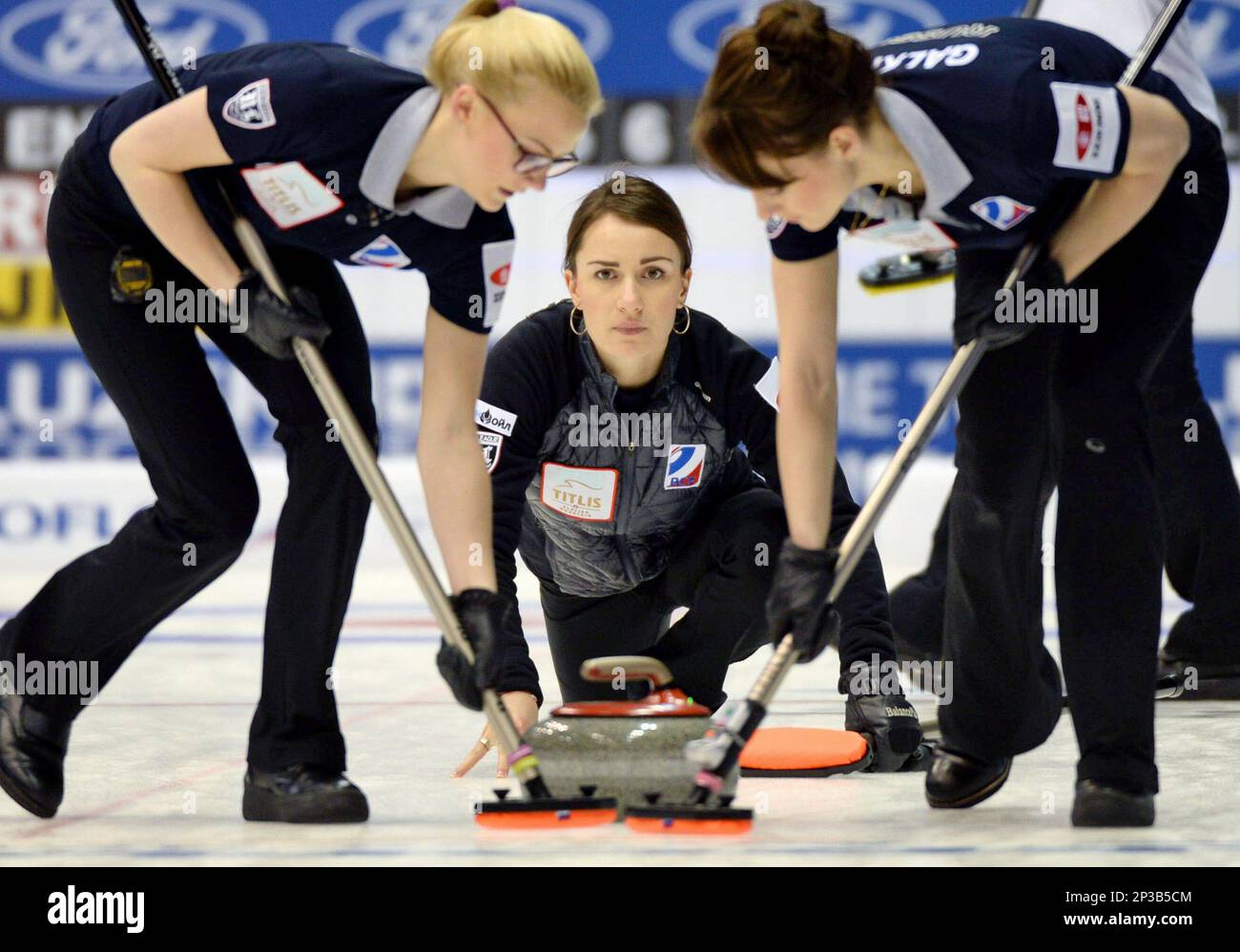 Russia's skip Anna Sidorova, center, watches Alexandra Saitova, left ...
