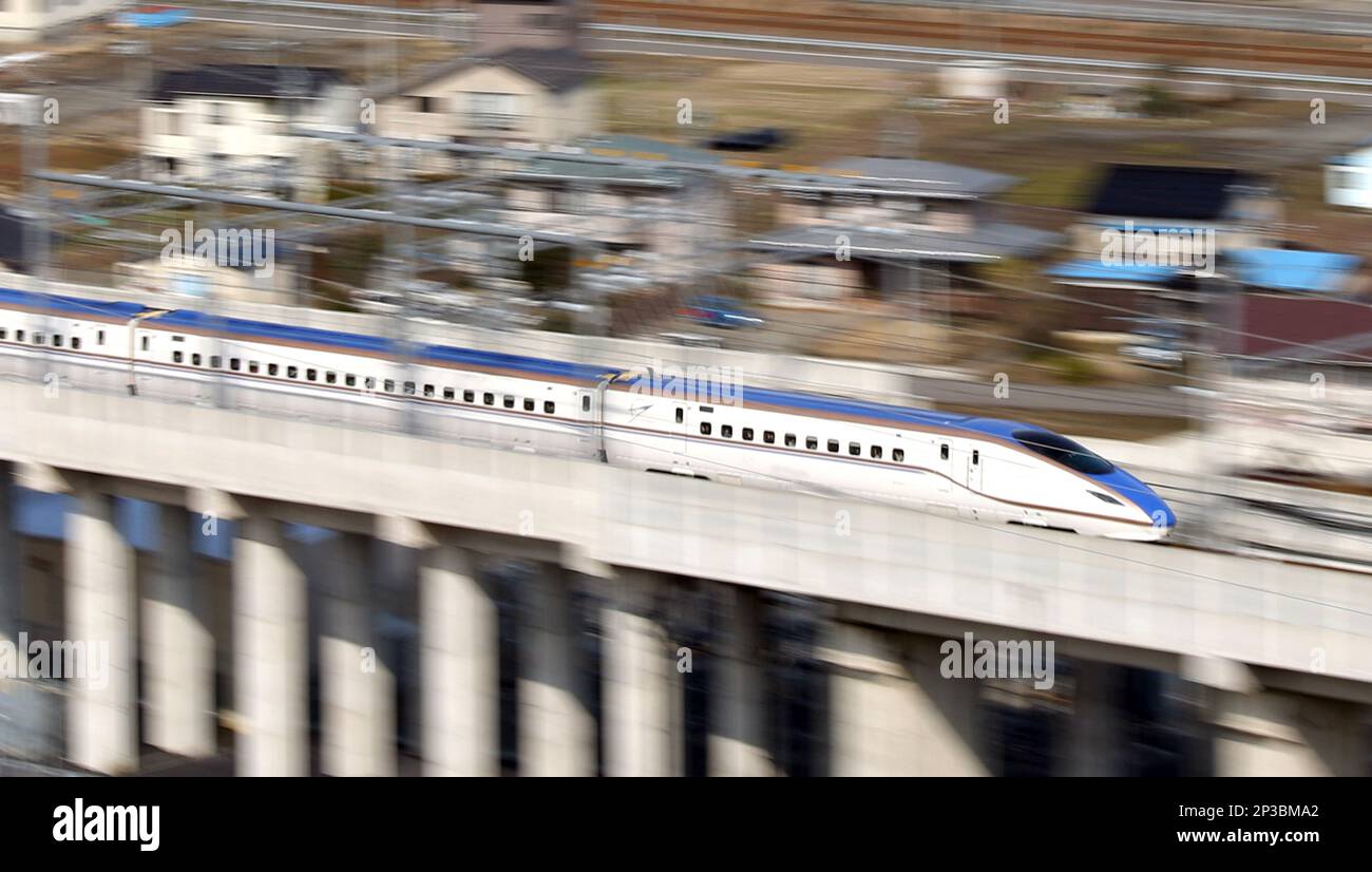A bullet train running on the Hokuriku Shinkansen line bound for Tokyo ...