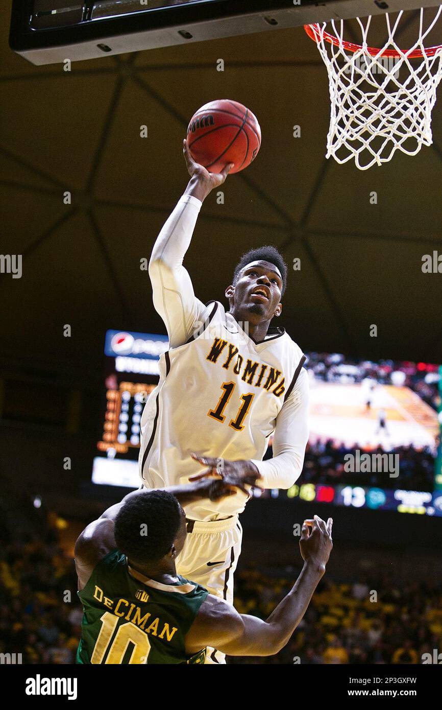 Cowboys senior forward Derek Cooke Jr. (11) drives towards the basket ...