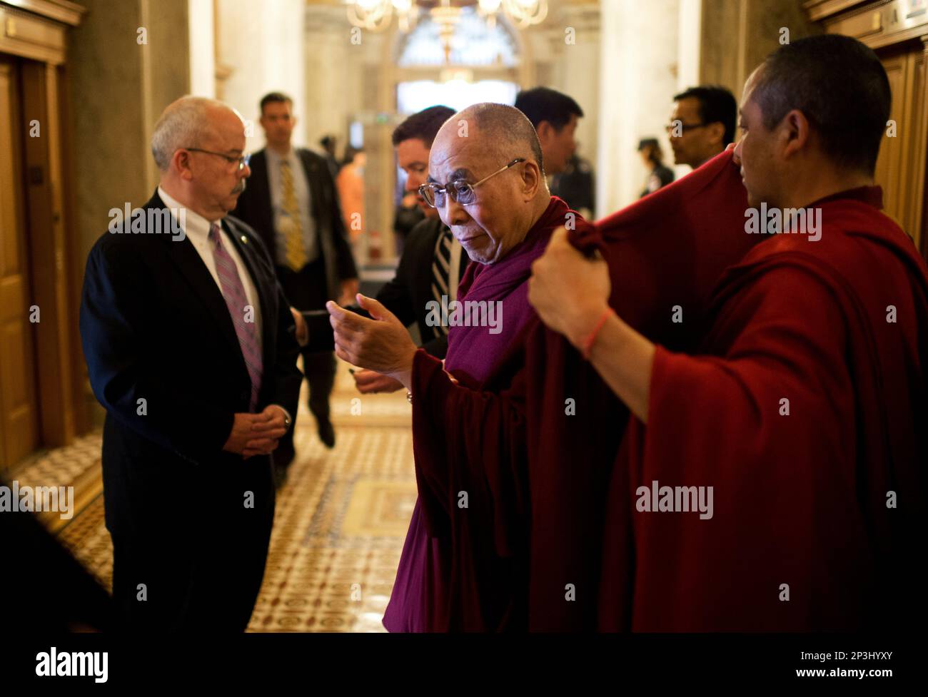 UNITED STATES - MARCH 06: The Dalai Lama prepares to go outside after a ...
