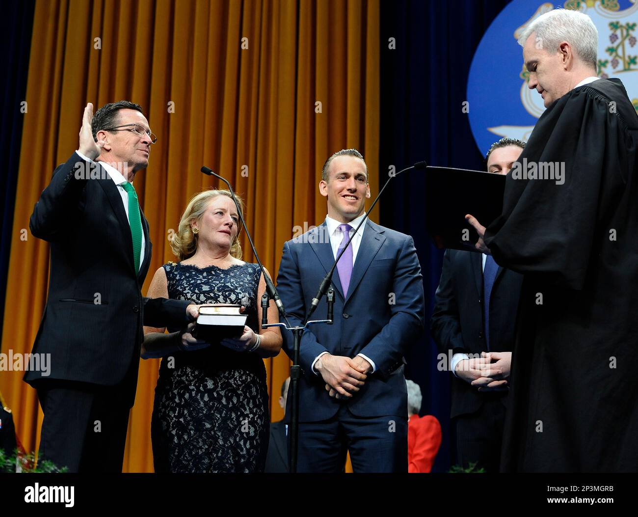 Gov. Dannel P. Malloy, left, is sworn in for his second term as ...