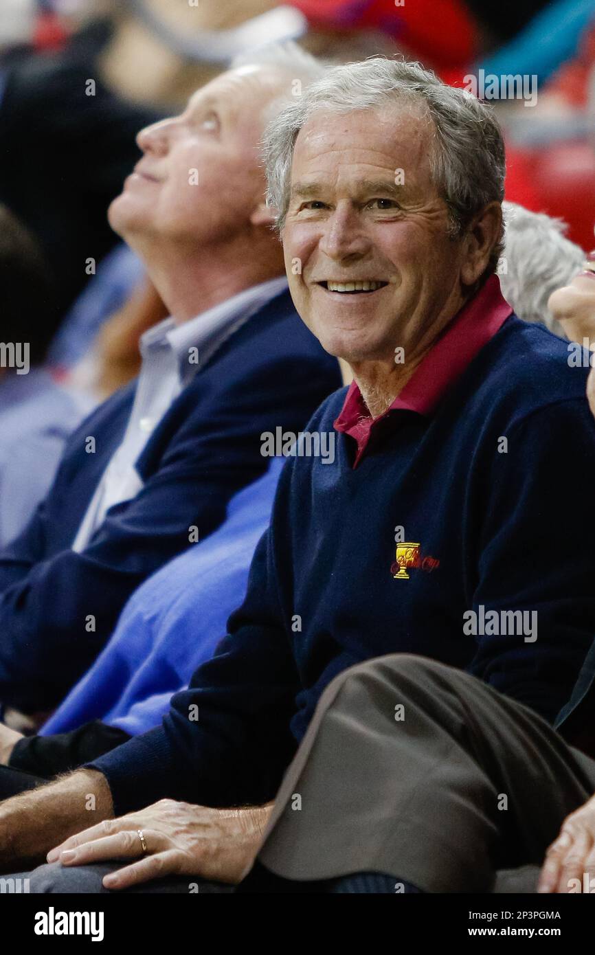 17 DEC 2014: President George W. Bush sits court side at the NCAA ...