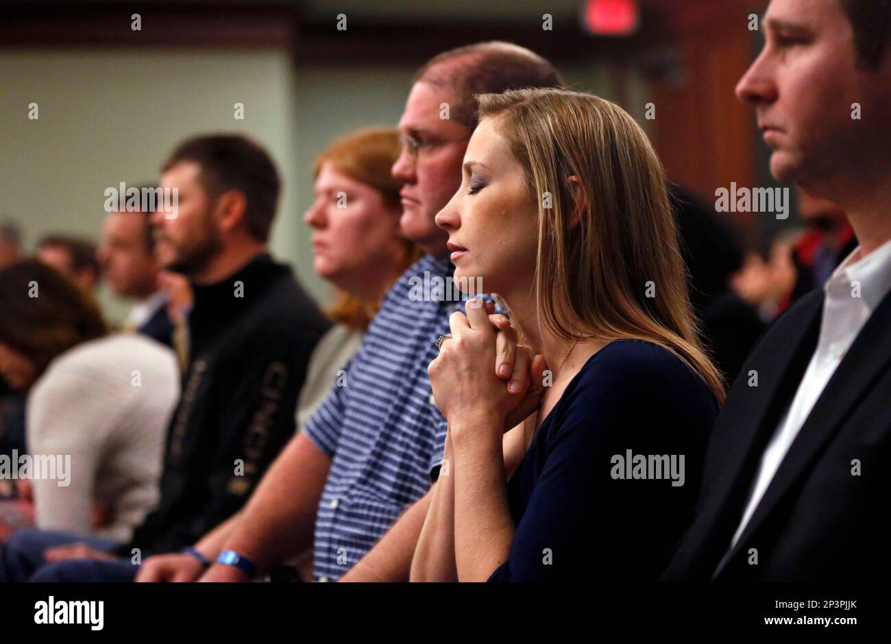 Christina Tomlinson, daughter of Cynthia McLelland, reacts next to her ...