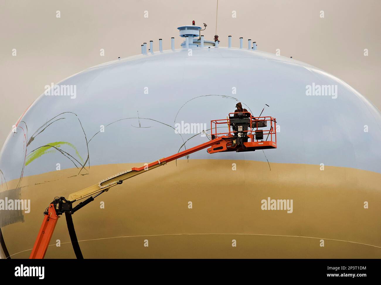 Eric Henn of Dayton, Ohio, maneuvers his lift outside the water tower ...