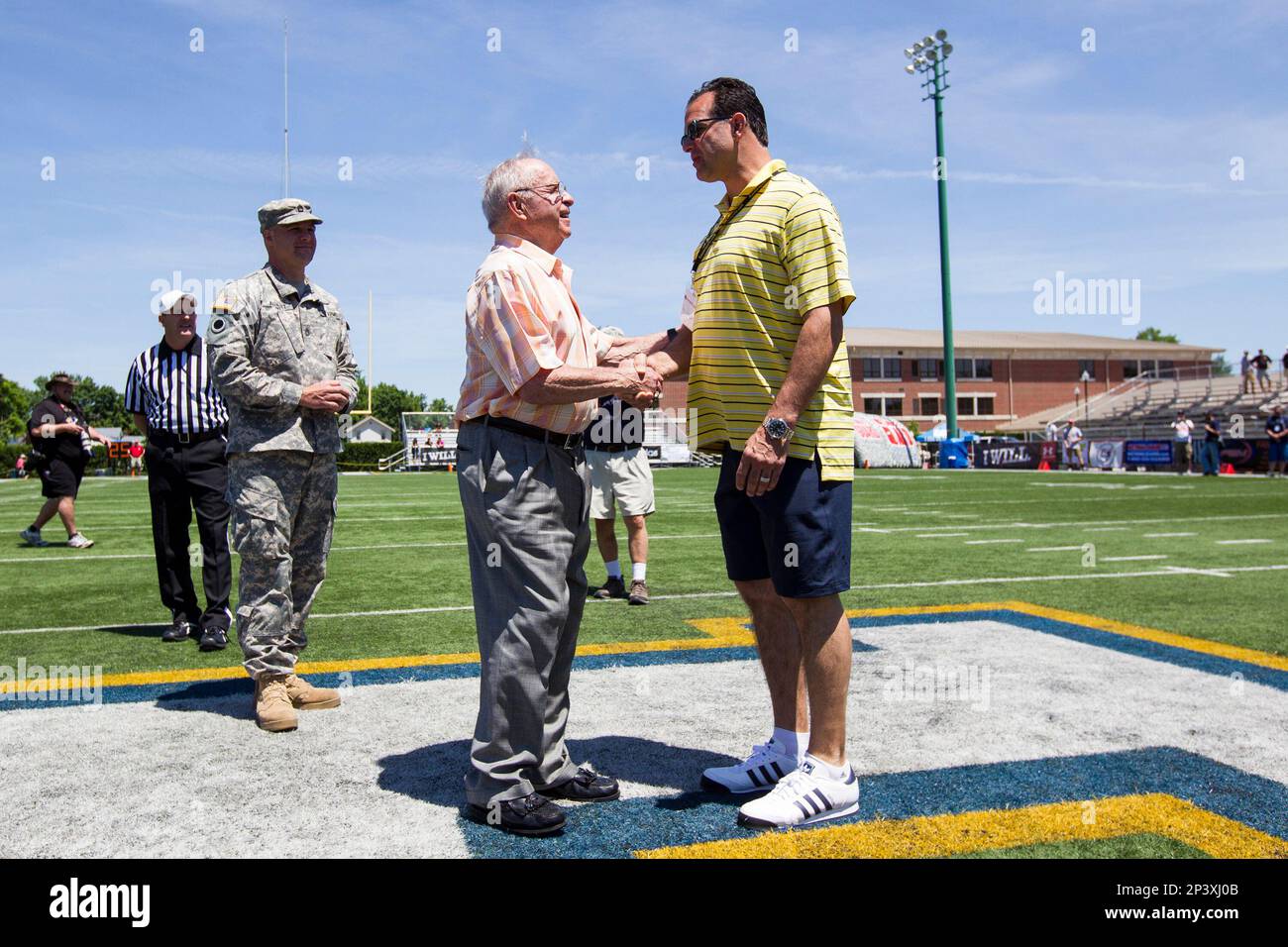 June 14, 2014: Former Ohio State head coach Earle Bruce (left) shakes ...