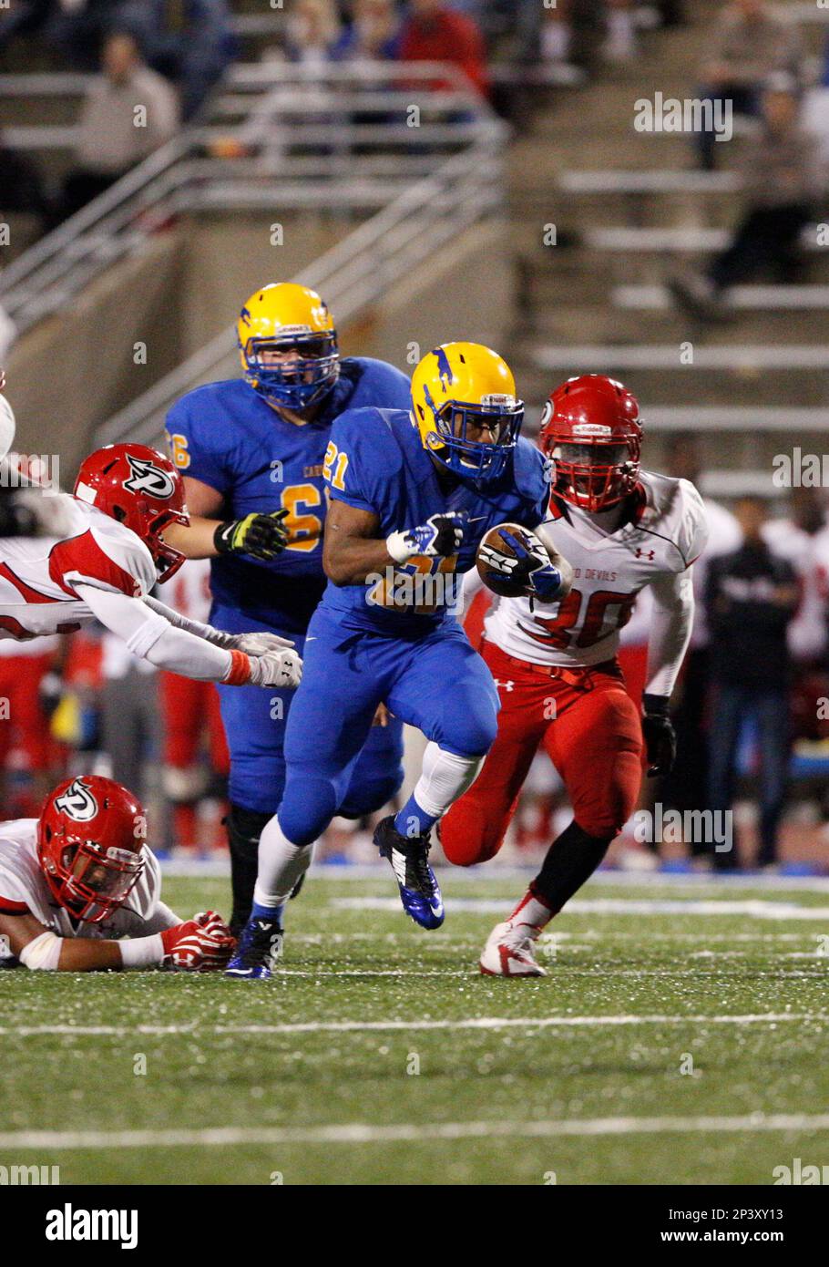 12 September 2014: Carmel running back Chris Perkins (21) breaks ...