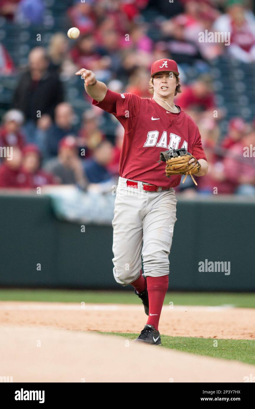 Alabama Crimson Tide infielder Chance Vincent (12) throws to first base ...
