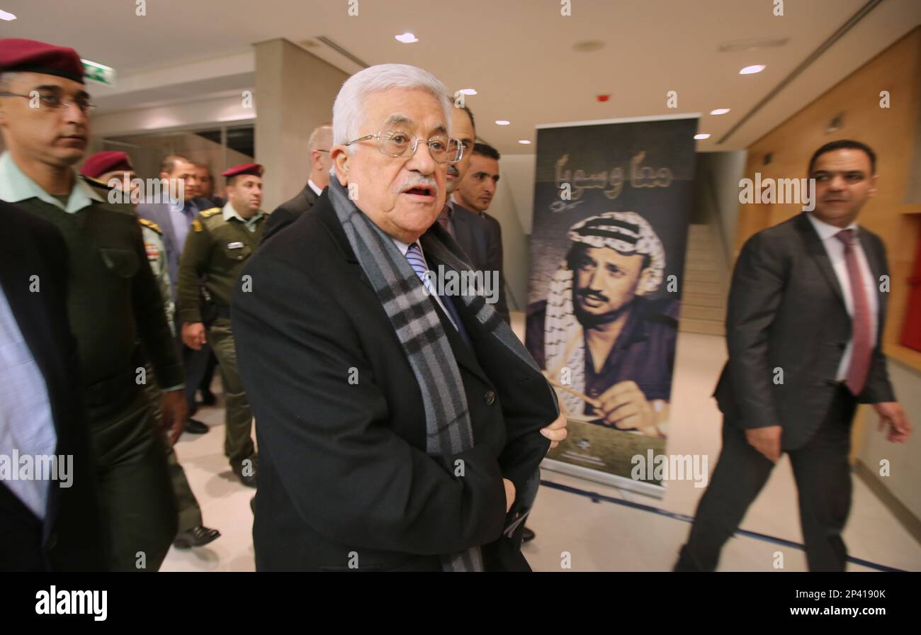 Palestinian President Mahmoud Abbas, center, arrives at the opening of ...