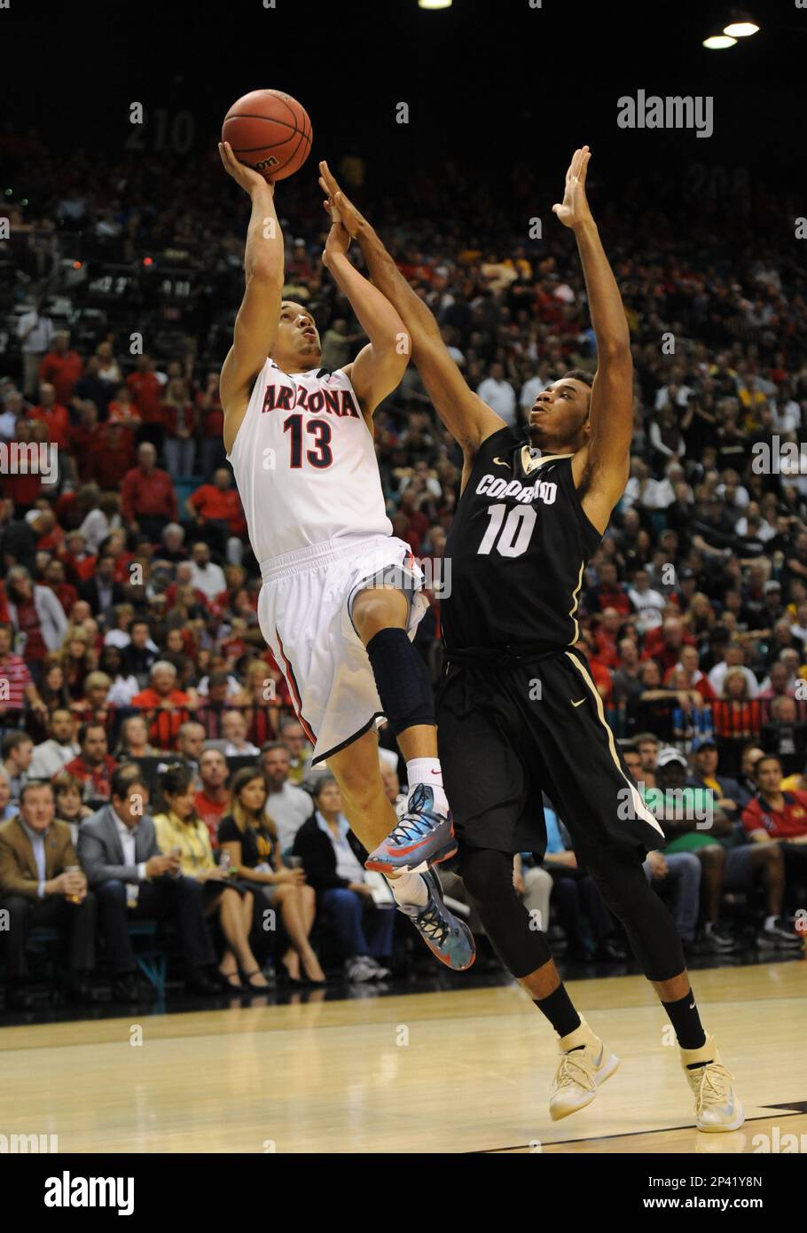 14 March 2014: Arizona (13) Nick Johnson shoots past Colorado (10) Tre ...
