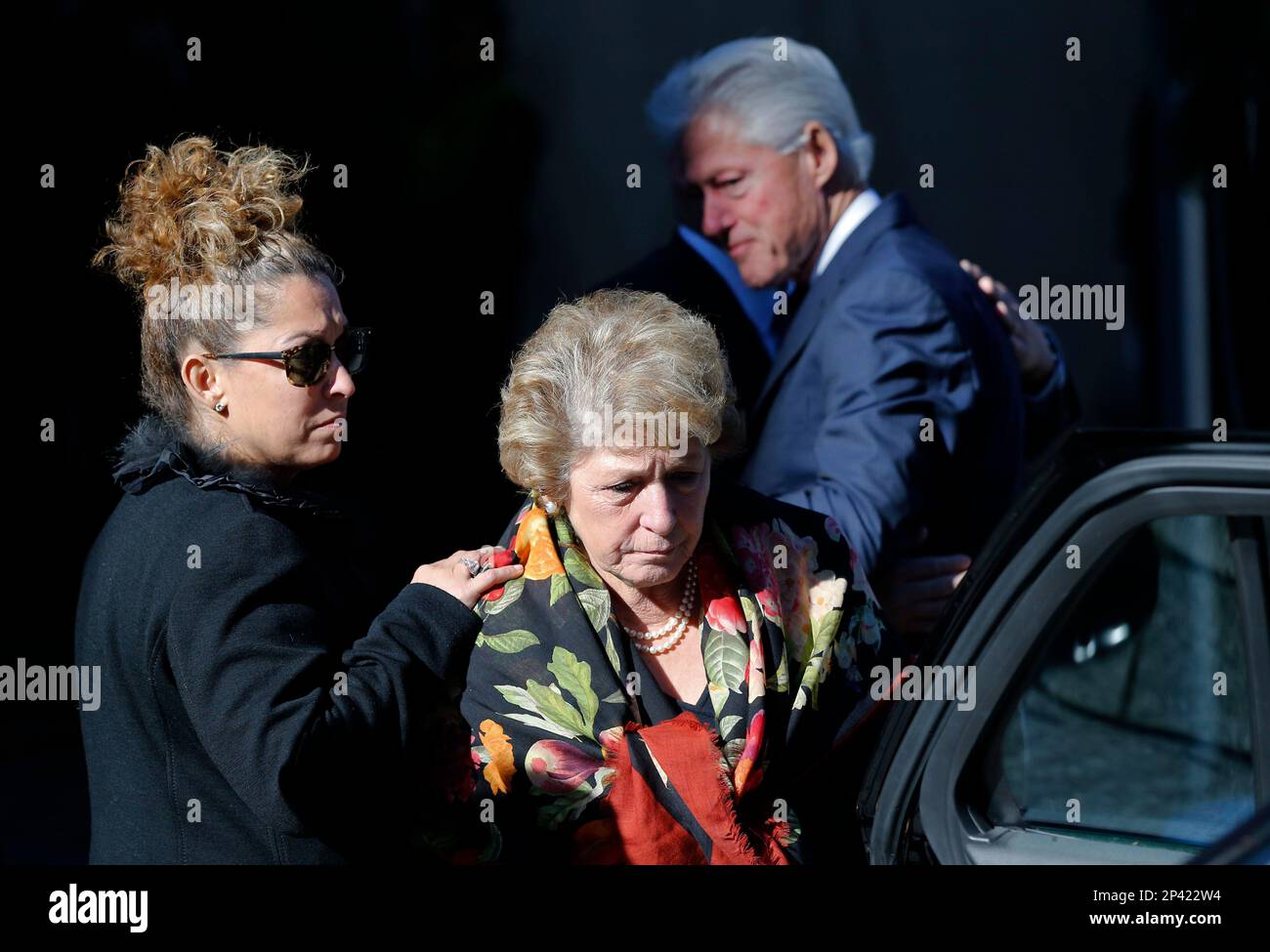 Former President Bill Clinton watches as Susan Menino Fenton, left ...