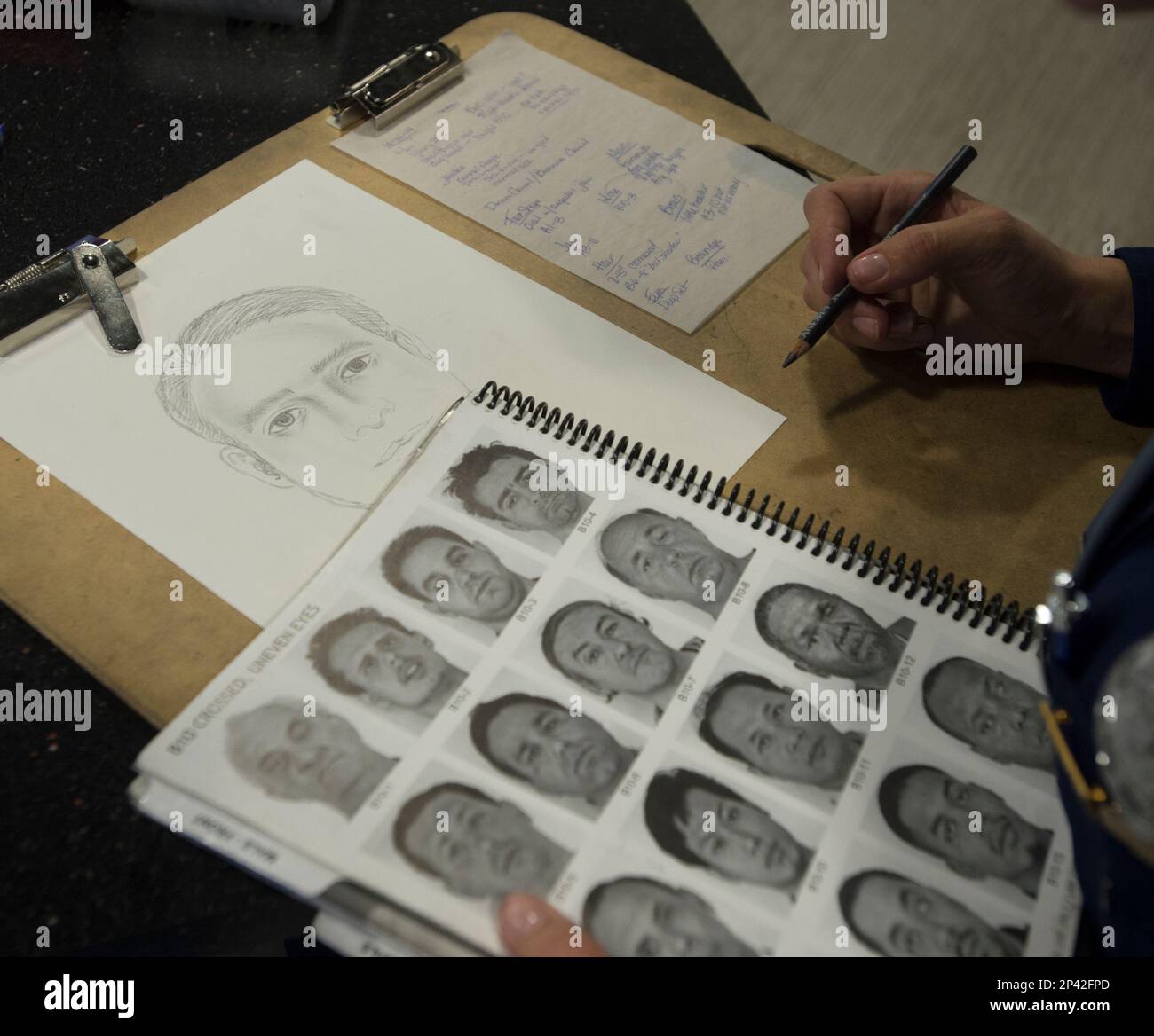Michigan State Police sketch artist Detective Trooper Sarah Krebs uses ...