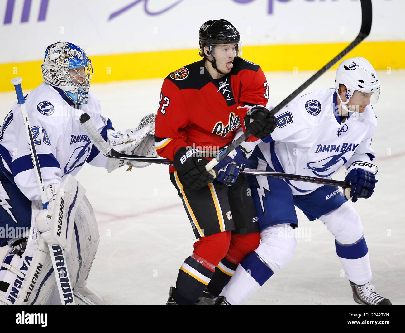 NHL profile photo on Calgary Flames' Paul Byron, centre, between Tampa ...