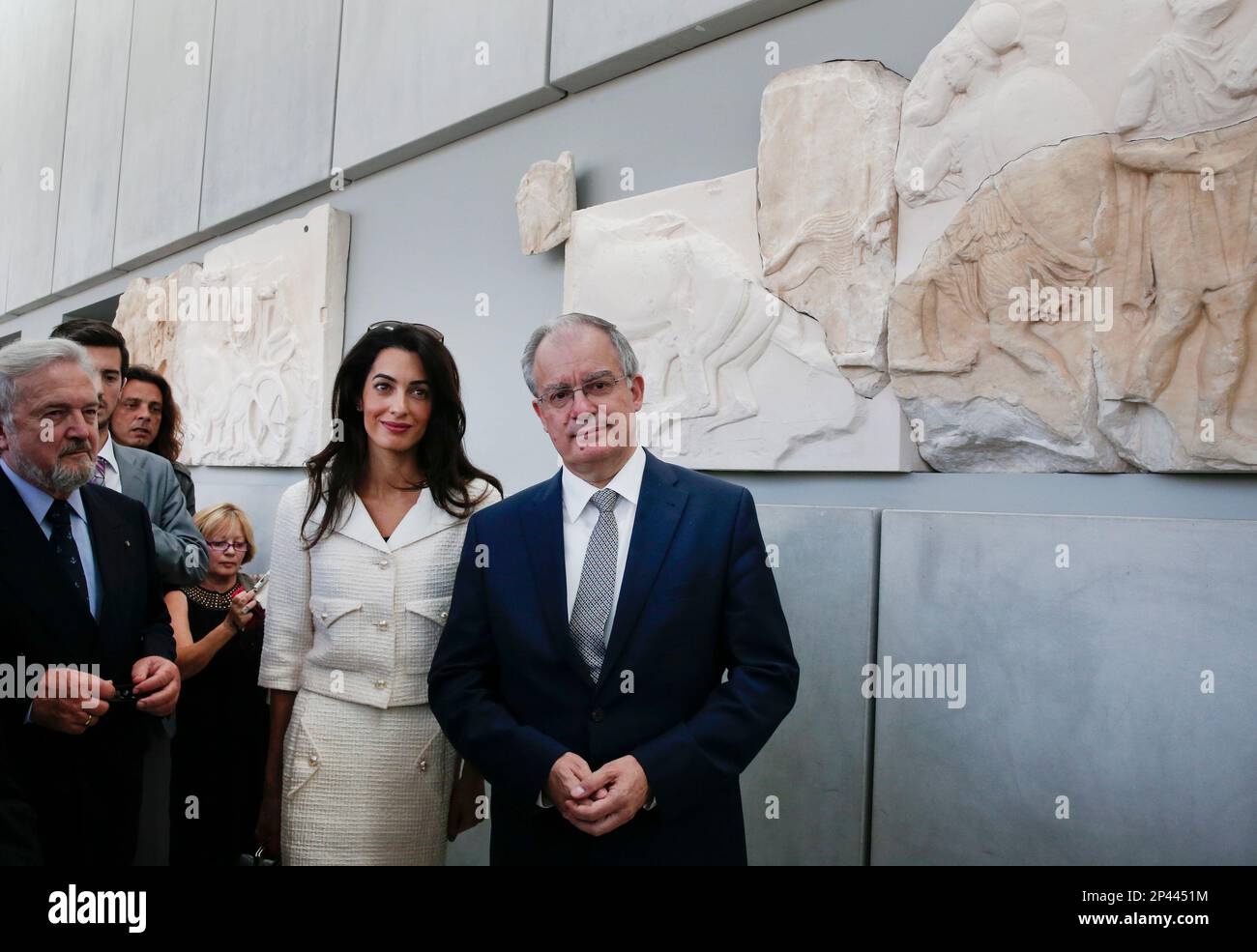 Lawyer Amal Clooney and Greek Minister of Culture and Sports Konstantinos Tasoulas, right ...