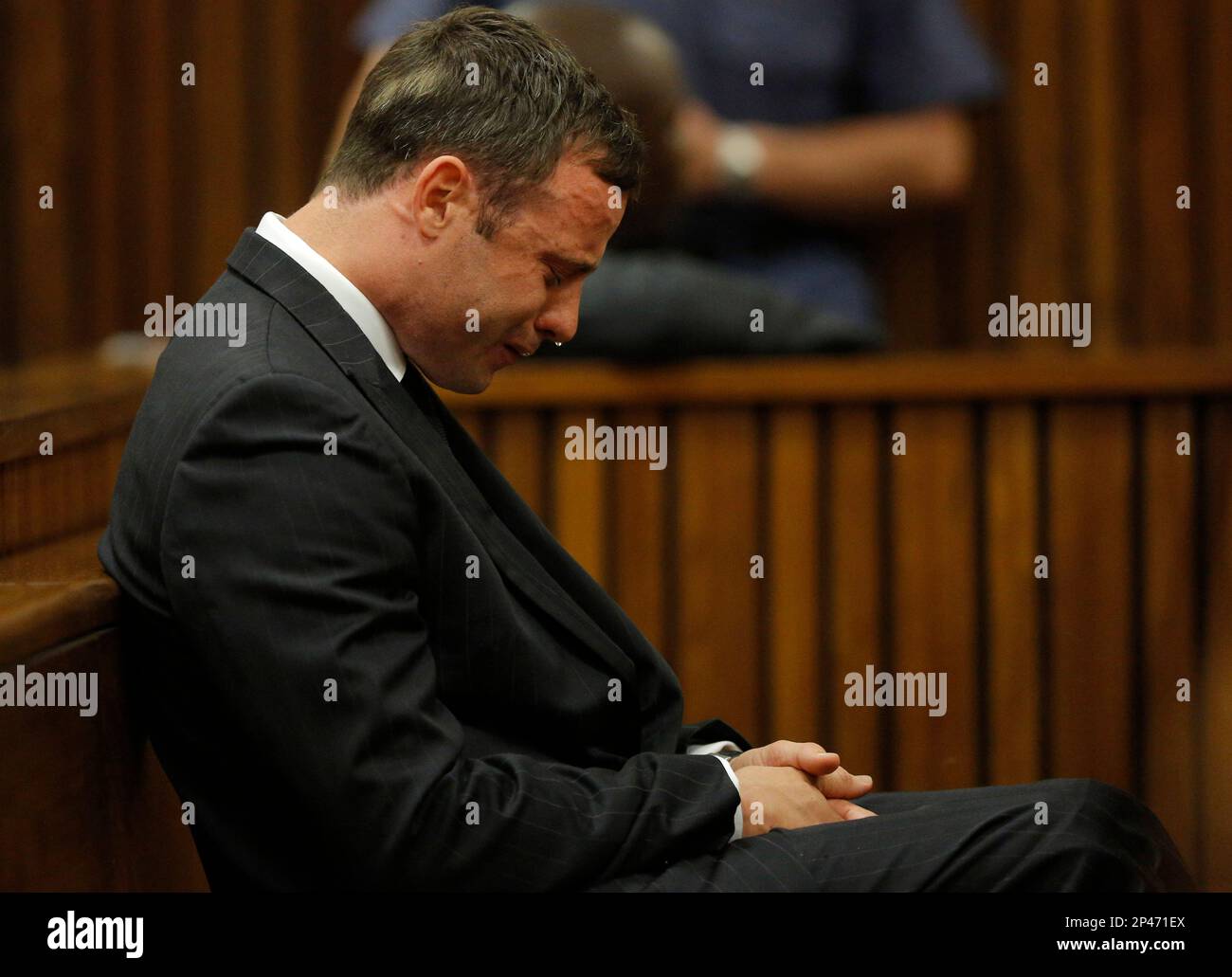 Oscar Pistorius cries in the dock in Pretoria, South Africa, Thursday ...