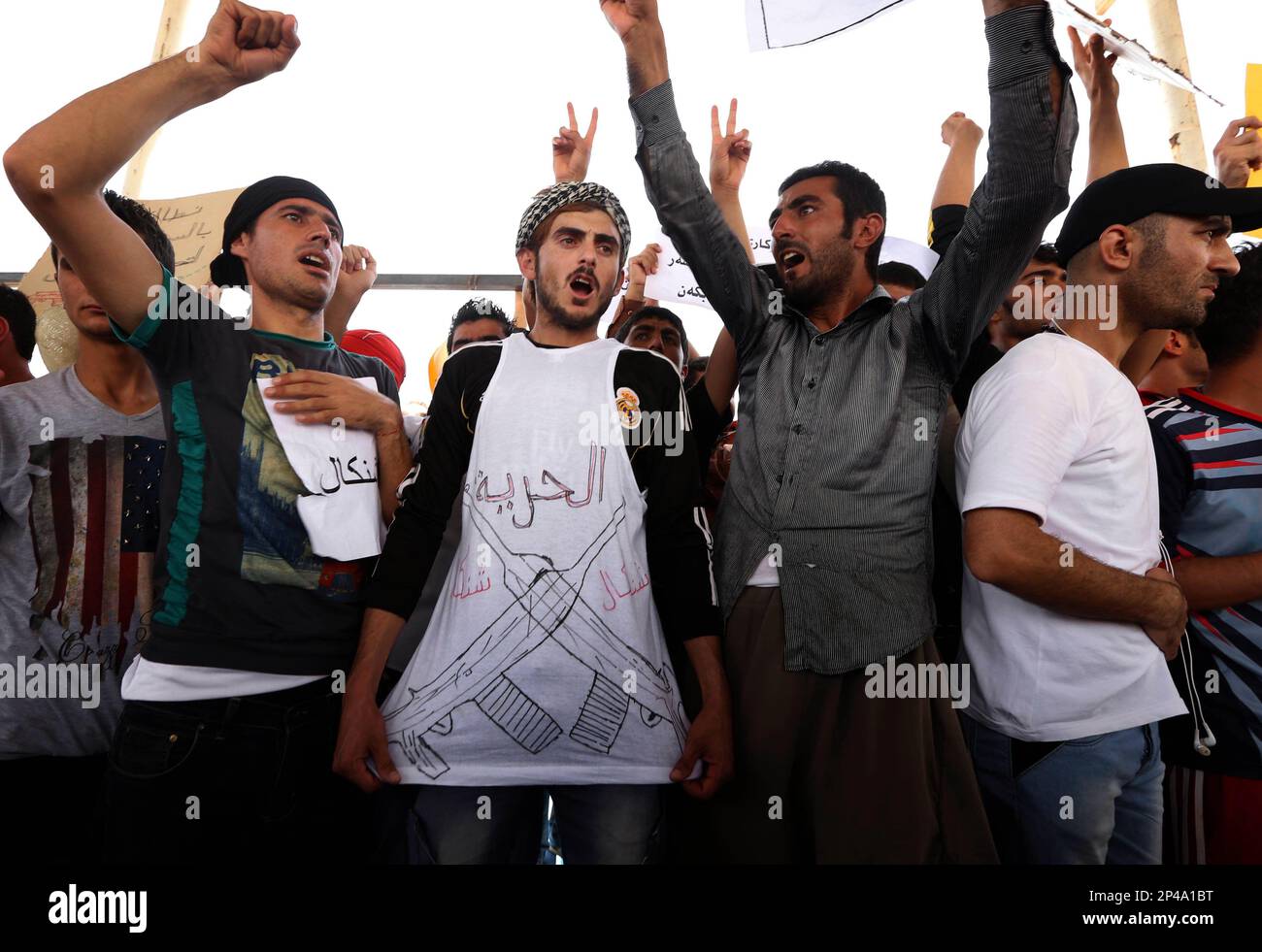 Iraqis from the Yazidi community chant anti Islamic militants slogans ...