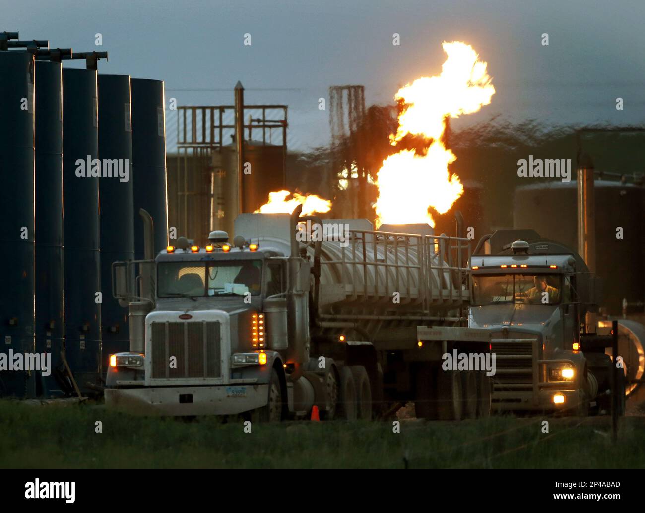 In this June 9, 2014 photo, drivers and their tanker trucks, capable of ...