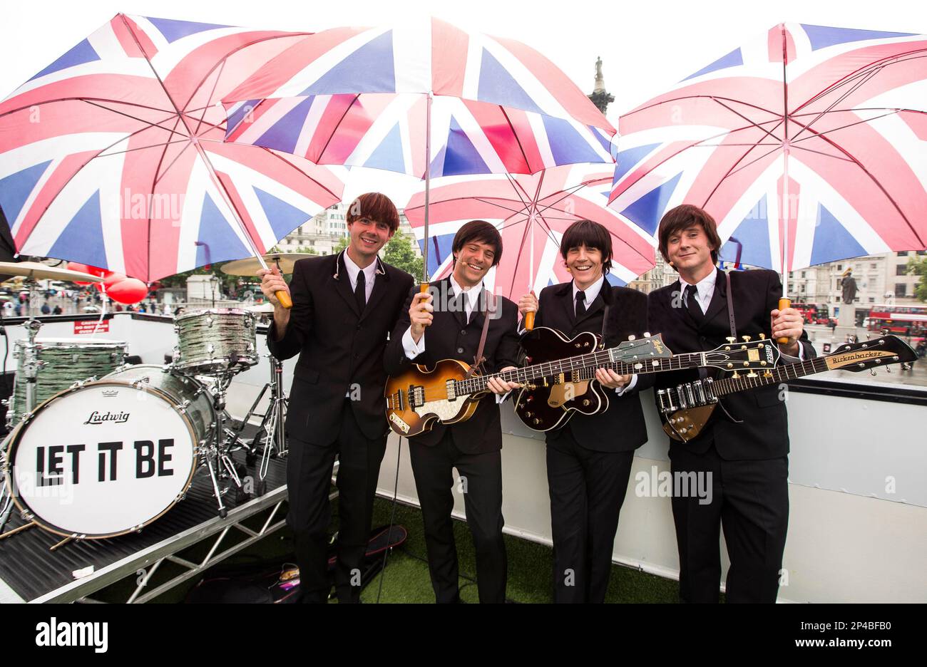 The cast of the musical show 'Let It Be', from left to right, Luke ...