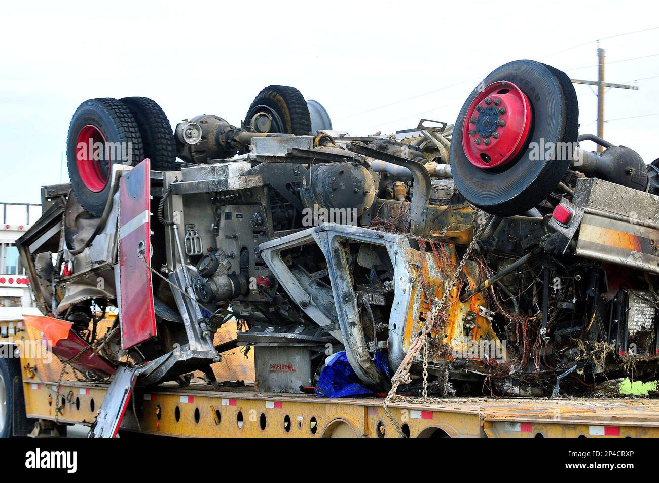 The wreckage of a Three Forks fire engine is loaded on a semi and ...