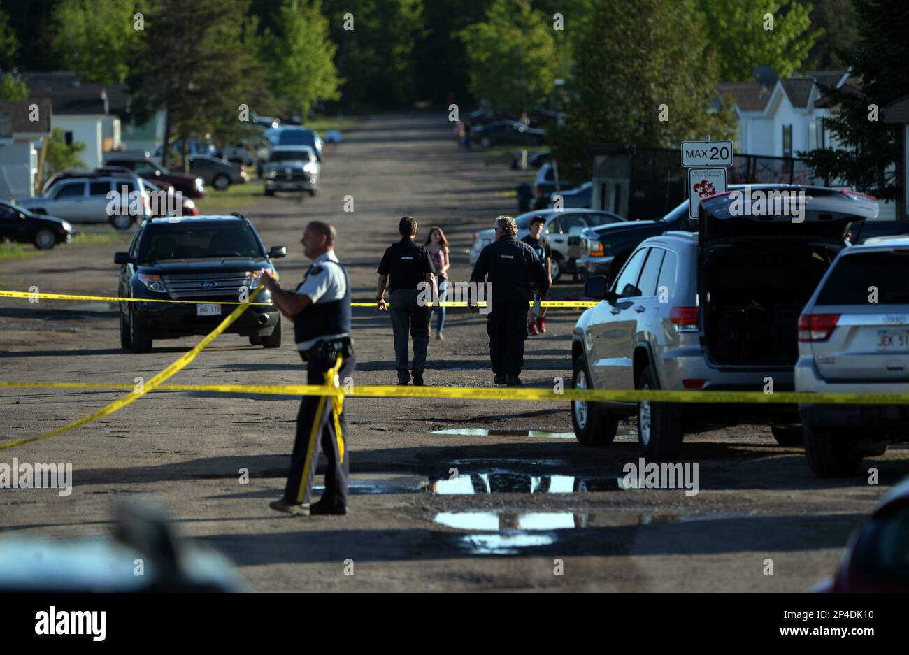 Royal Canadian Mounted Police investigators work at the home of ...