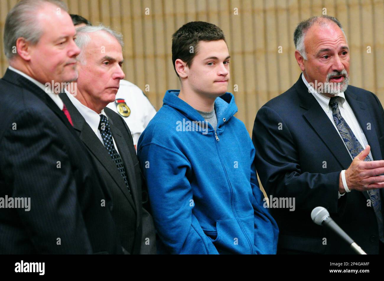 Christopher Plaskon, 16, second from right, stands with defense ...