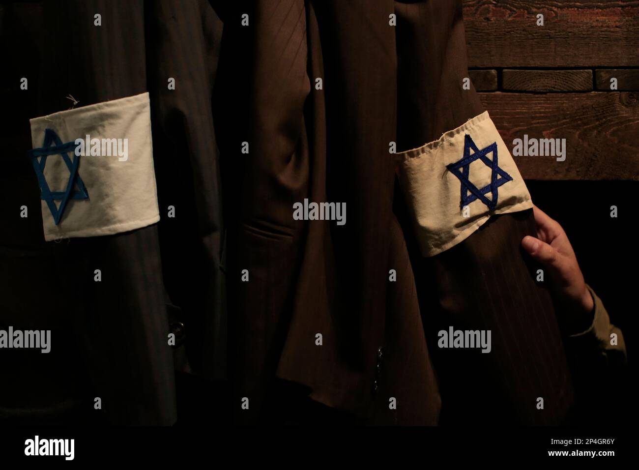 An Israeli officer looks at a jacket with a Star of David arm band, in ...