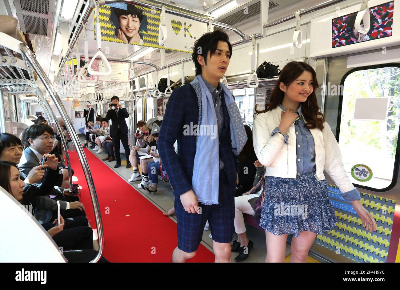 Models perform in a train car on the Inokashira Line of the Keio ...