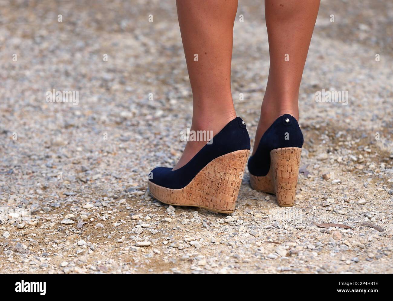 Britain's Kate, the Duchess of Cambridge, wears high heel shoes while ...