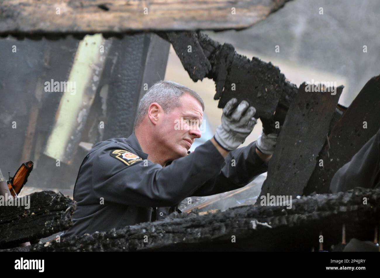 Pennsylvania State Police Fire Marshall Todd James looks through the ...