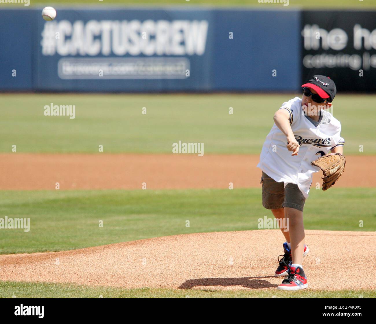 Ten-year-old Mason Hobbs throws out the first pitch, as Maryvale ...