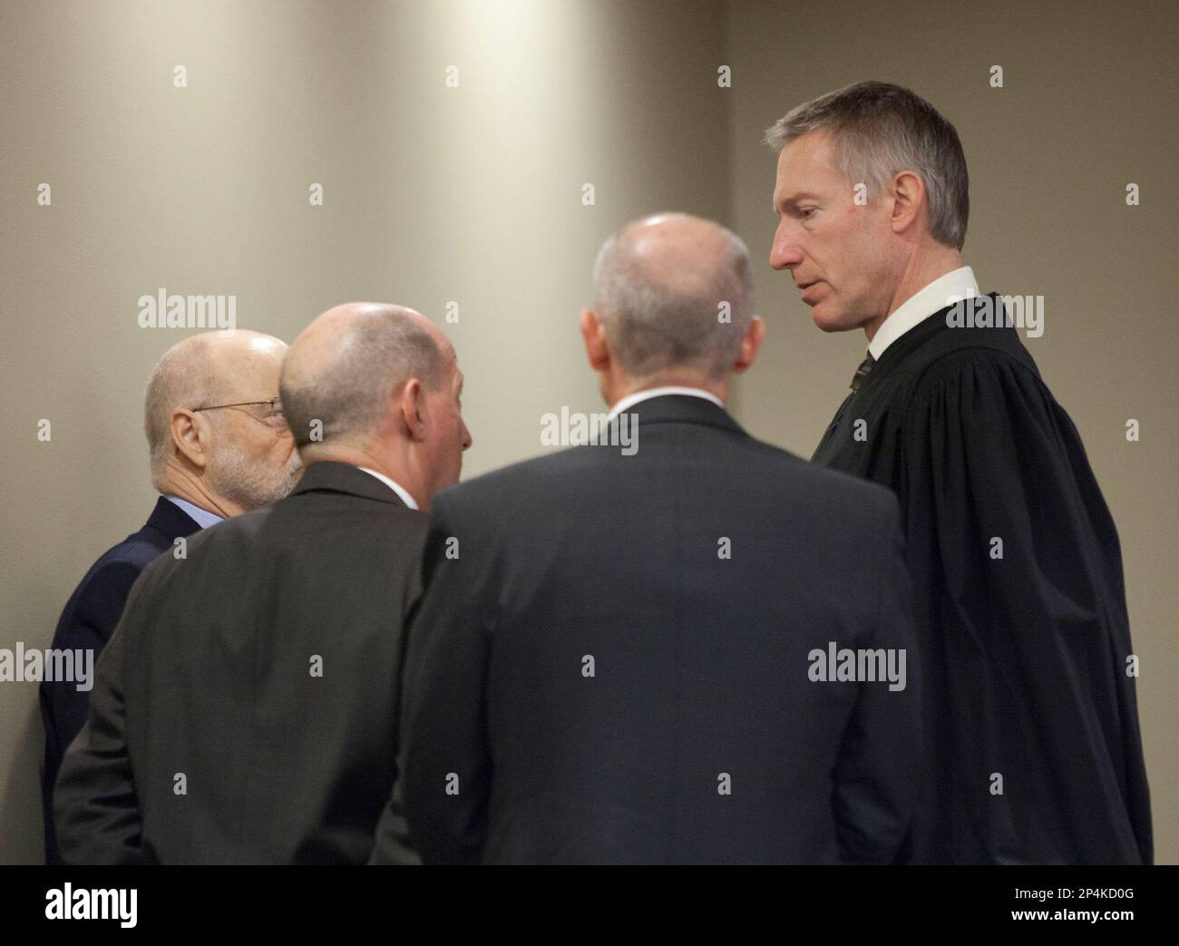 Judge Jon Hulsing, right, talks with, from left, defense attorneys ...