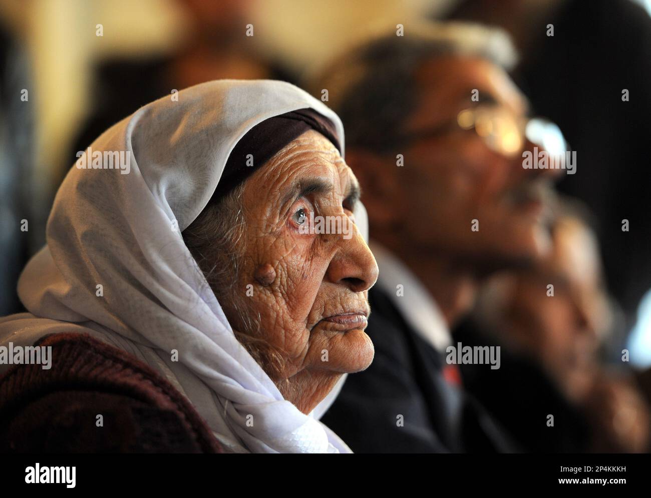 107-year-old Syrian Sabria Khalaf, left, sits next to her son Kanan Ali ...