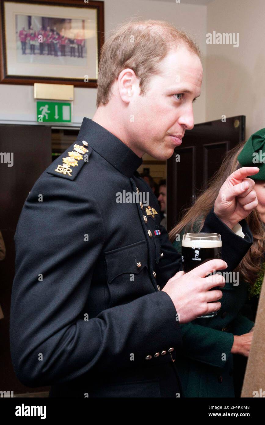 Prince William holds a pint of Guinness during a visit to the 1st ...