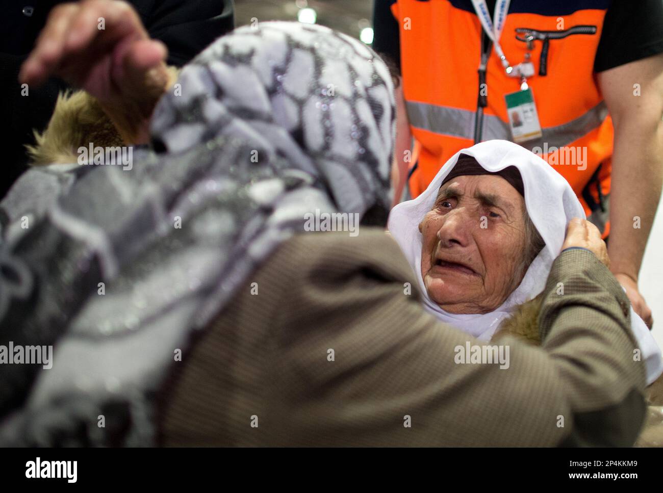 107-year-old Syrian Sabria Khalaf, right, is greeted by a family member ...