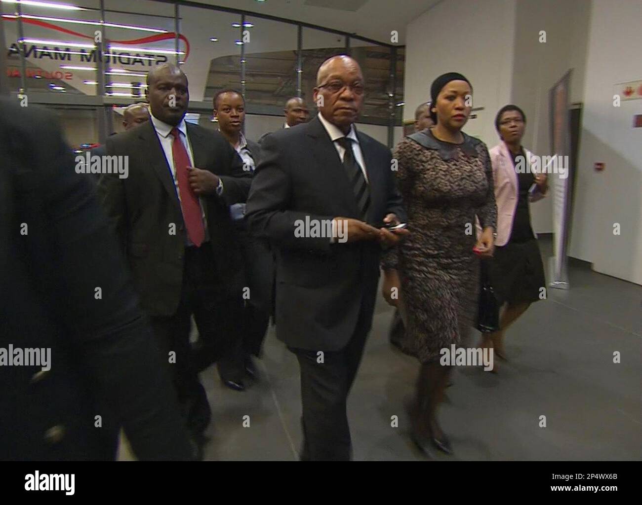 In this image from TV, South African President Jacob Zuma, centre ...