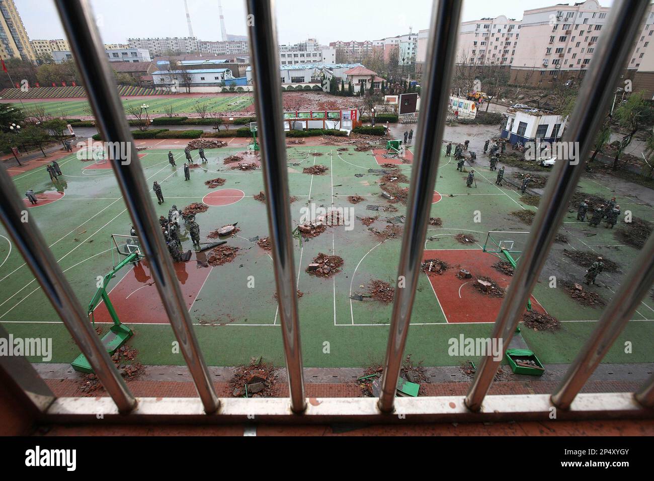 Rescuers work at a damaged middle school after a pipeline explosion in ...