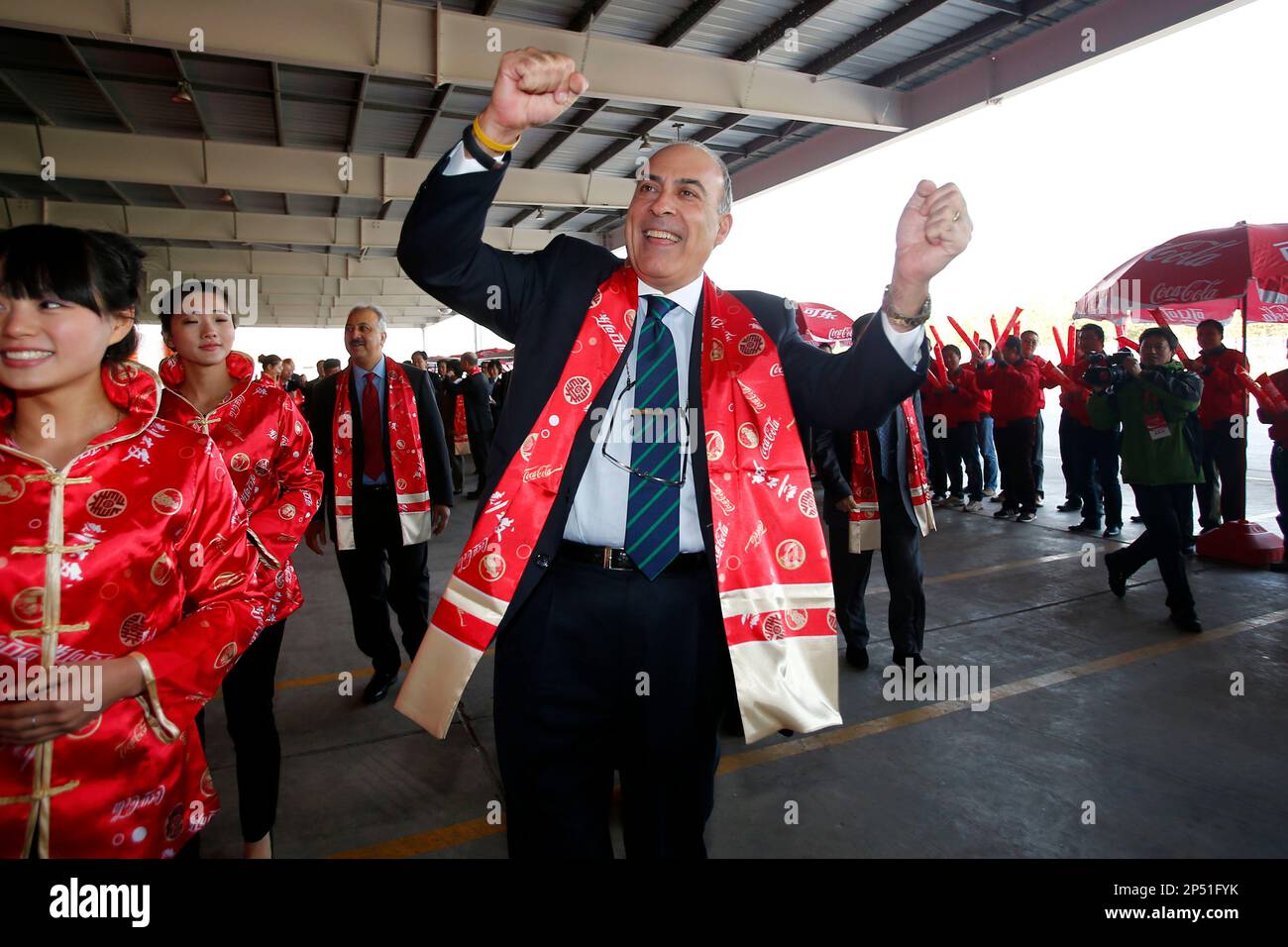 Coca-Cola Chairman and CEO Muhtar Kent (C) attends the inauguration of ...