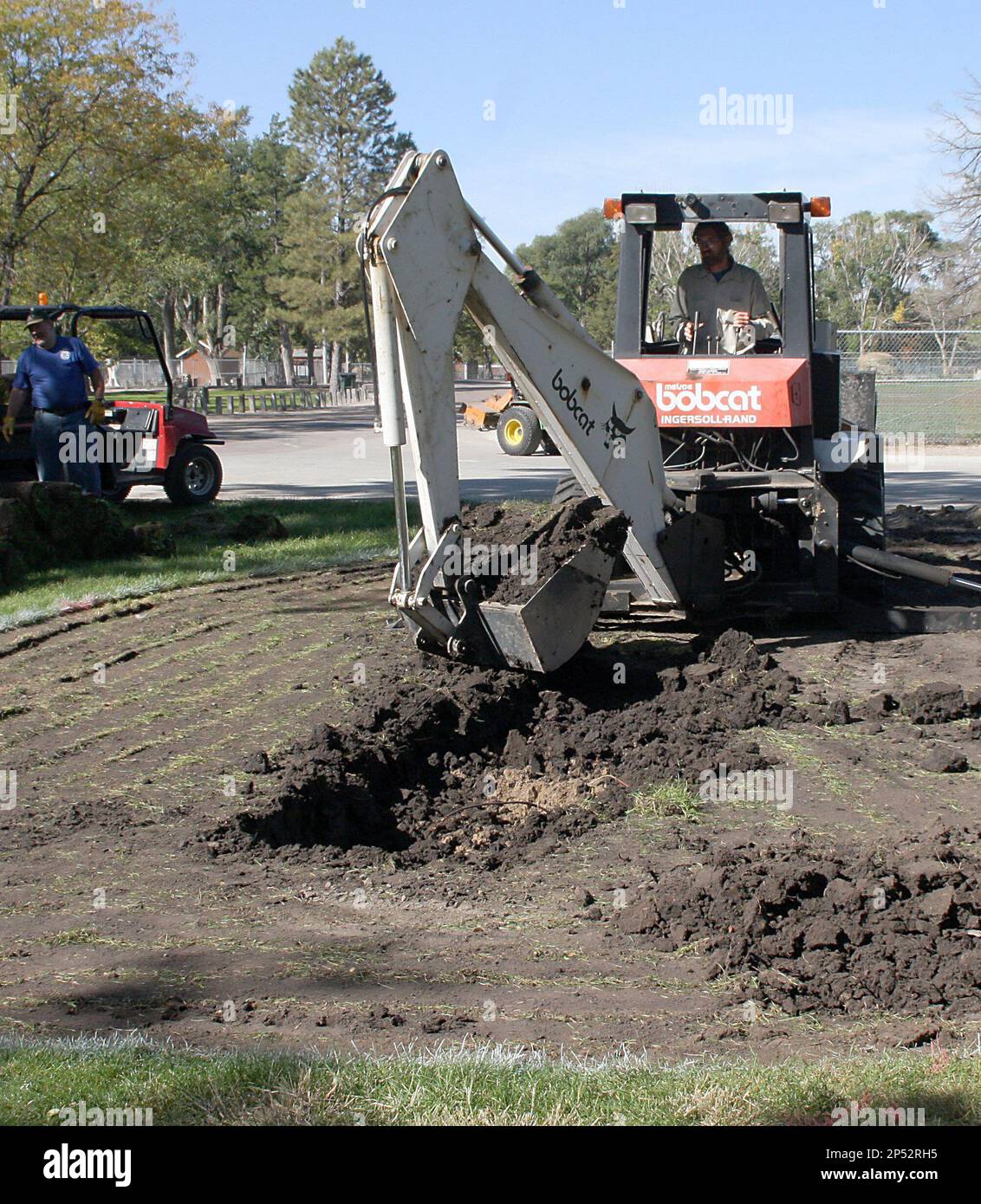 In this undated photo, a city of North Platte crew work to turn a patch ...