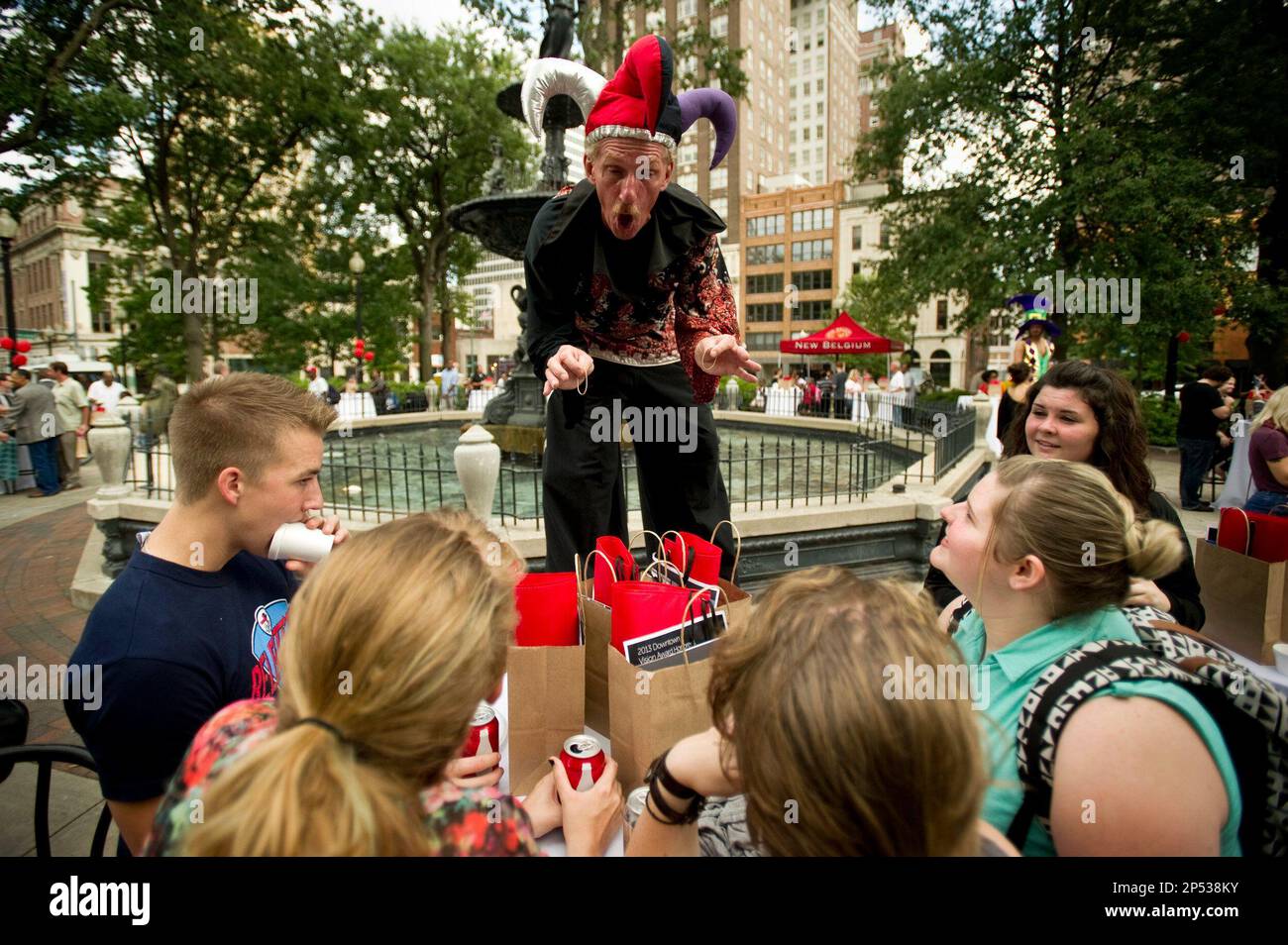 Stilt-walker Kid Davie entertains Visible Music School students Daniel ...