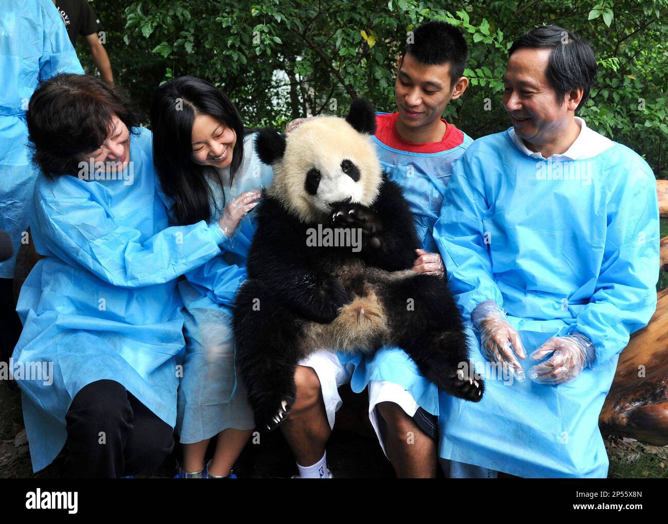 NBA star Jeremy Lin, second from right, of Houston Rockets, his mother ...
