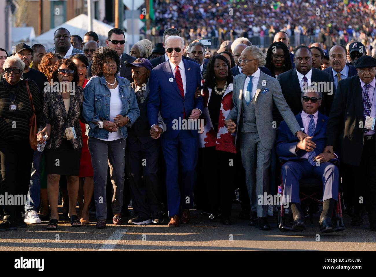 President Joe Biden walks across the Edmund Pettus Bridge in Selma, Ala ...