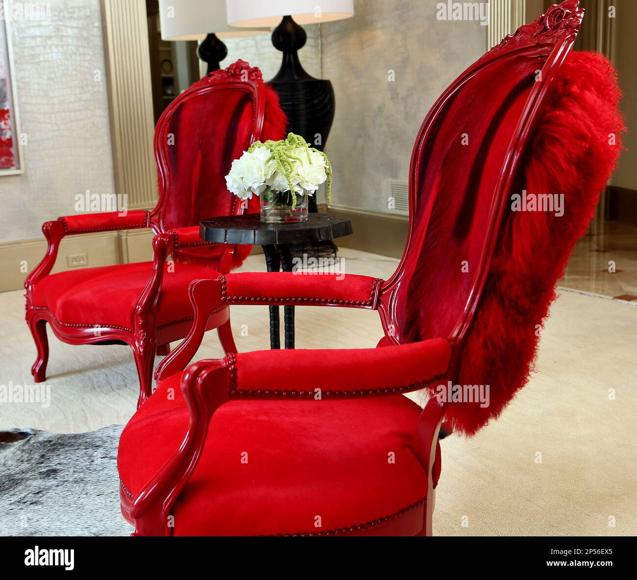 Red fur chairs are featured in the "Piano room" of Real Housewife star ...