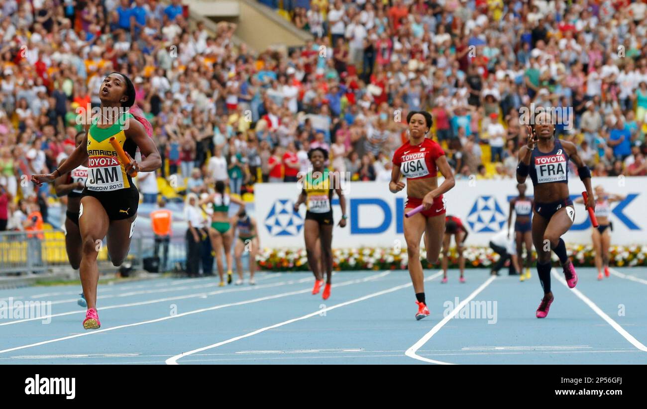 Jamaica's Shelly-Ann Fraser-Pryce, left, crosses the finish line to win ...