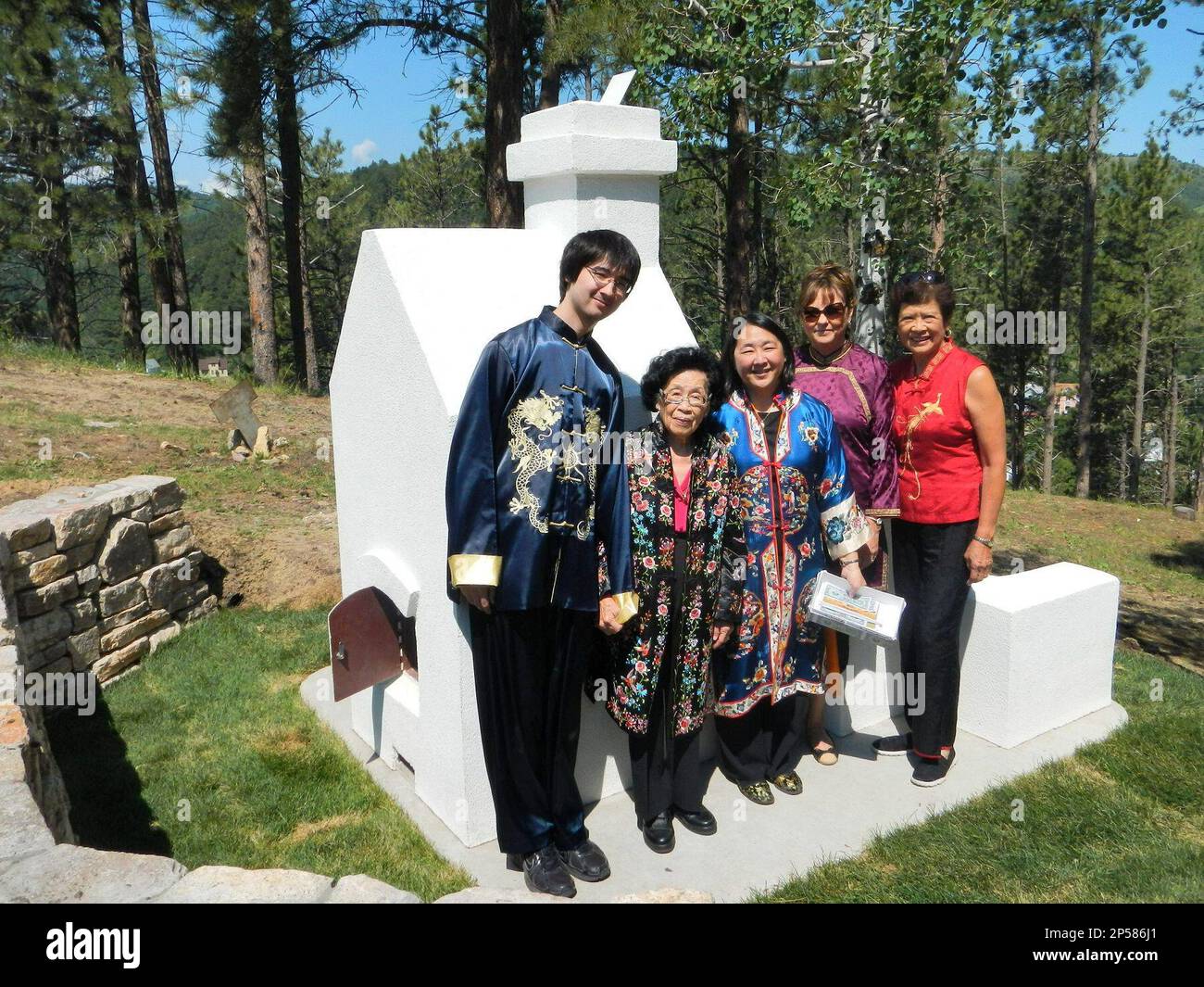 Descendants of pioneer Deadwood merchant Fee Lee Wong pose in front of ...