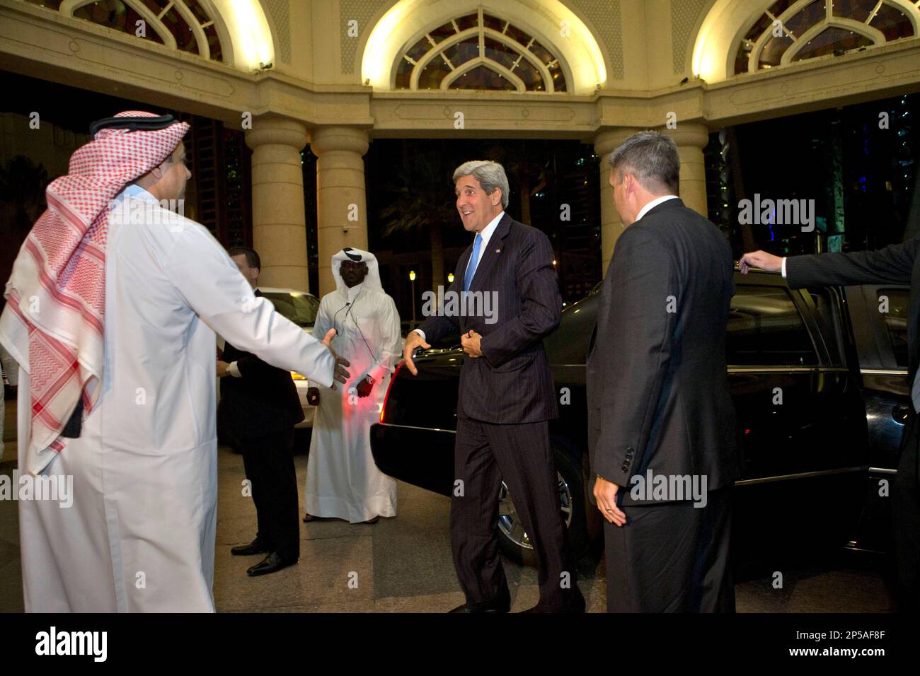 U.S. Secretary of State John Kerry, center, greets Qatari Prime ...