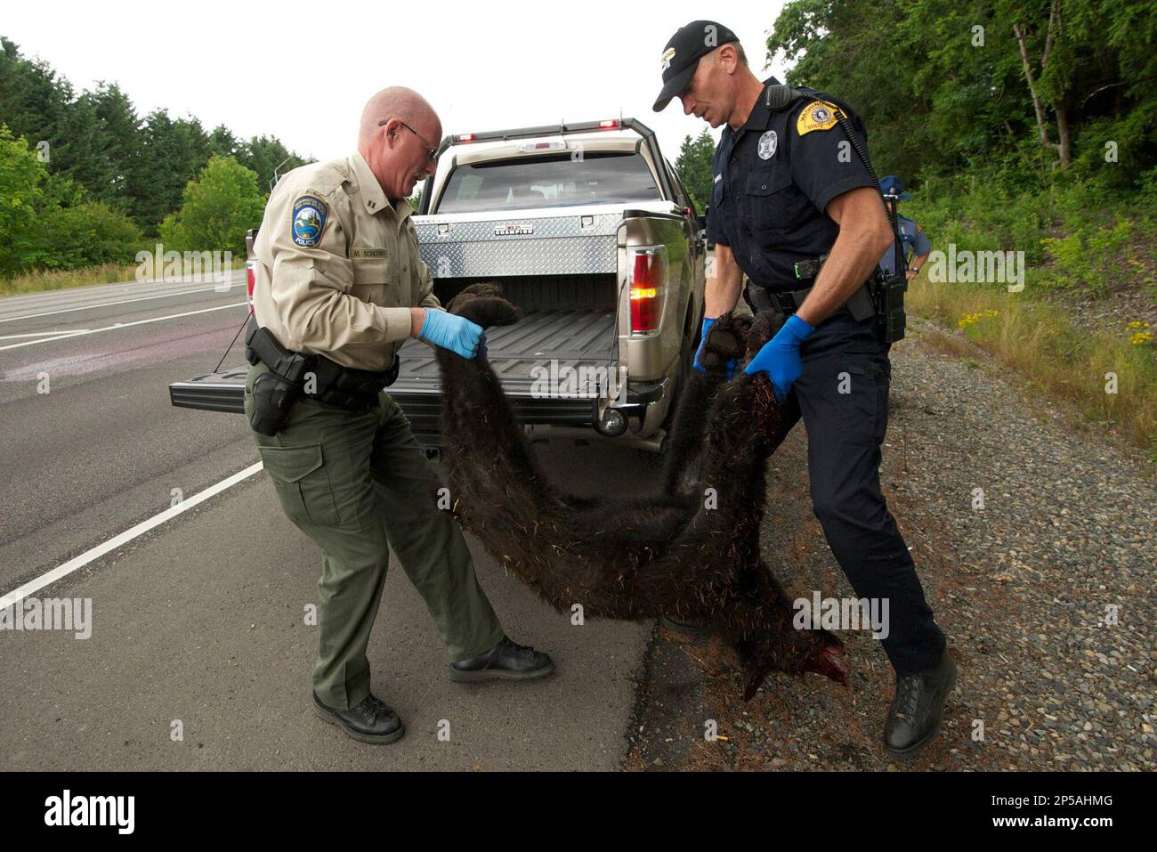 In this Wednesday, June 19, 2013 photo, Capt. Murray Schlenker, left ...