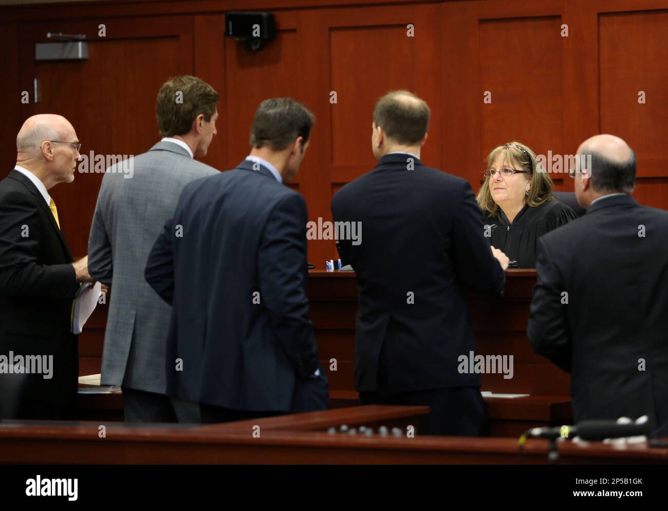 Judge Debra Nelson Second From Right Speaks With The Defense And