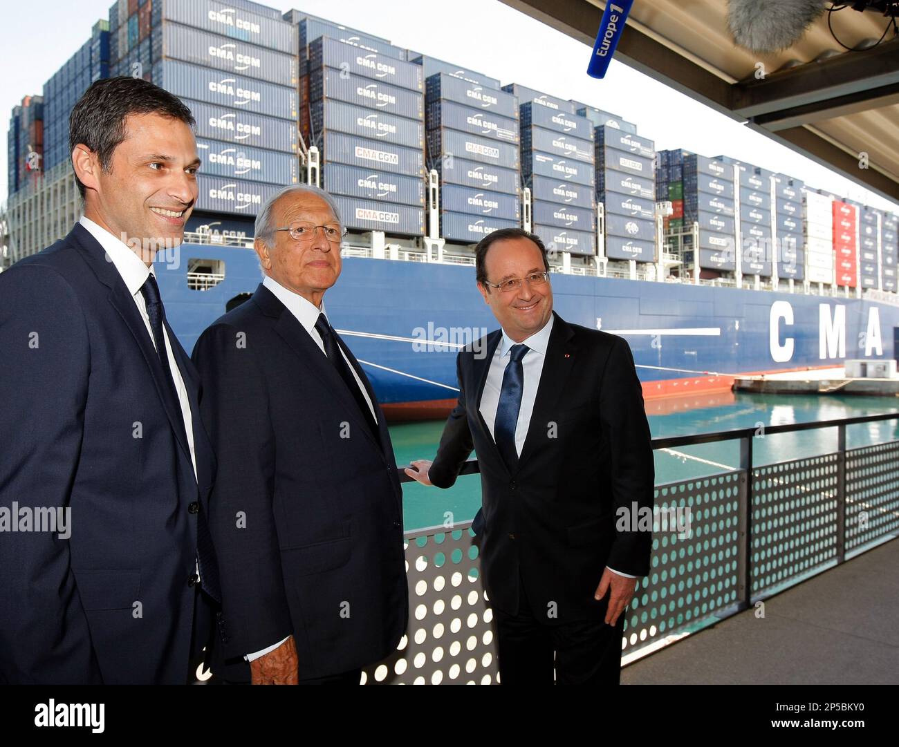 France's President Francois Hollande, poses with Jacques Saade, center ...