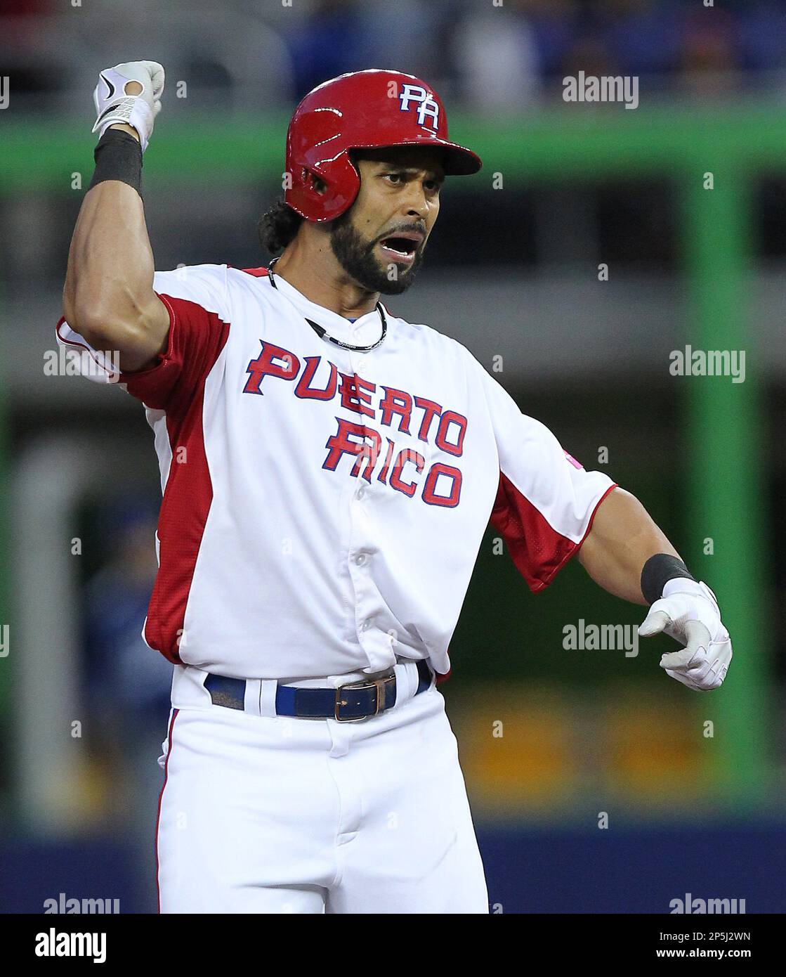 Puerto Rico center field Angel Pagan reacts after hit a doubles during ...