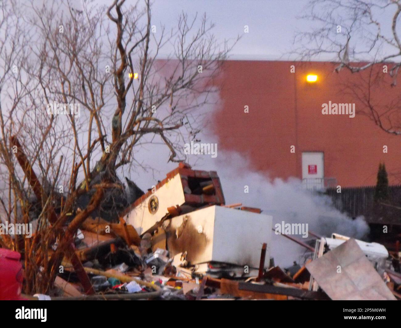 Debris is scattered after an explosion at a duplex apartment on Tuesday ...
